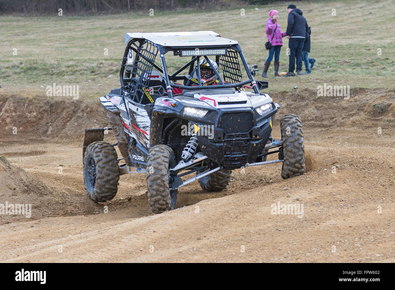 Front view of the blue off road car entering a curve a Stock Photo - Alamy