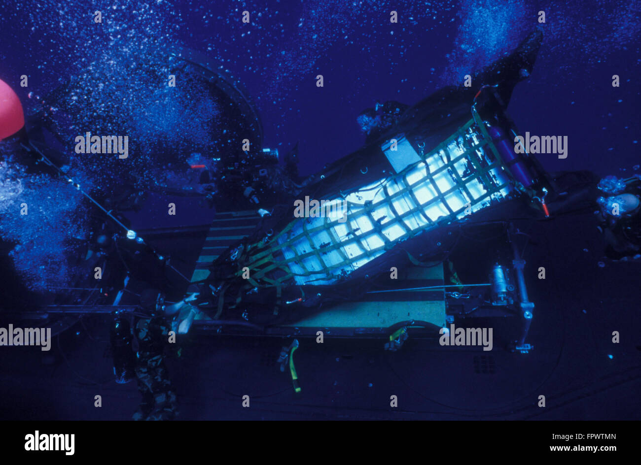 Dry Deck Shelter (DDS) operators use the buoy and winch line to ...