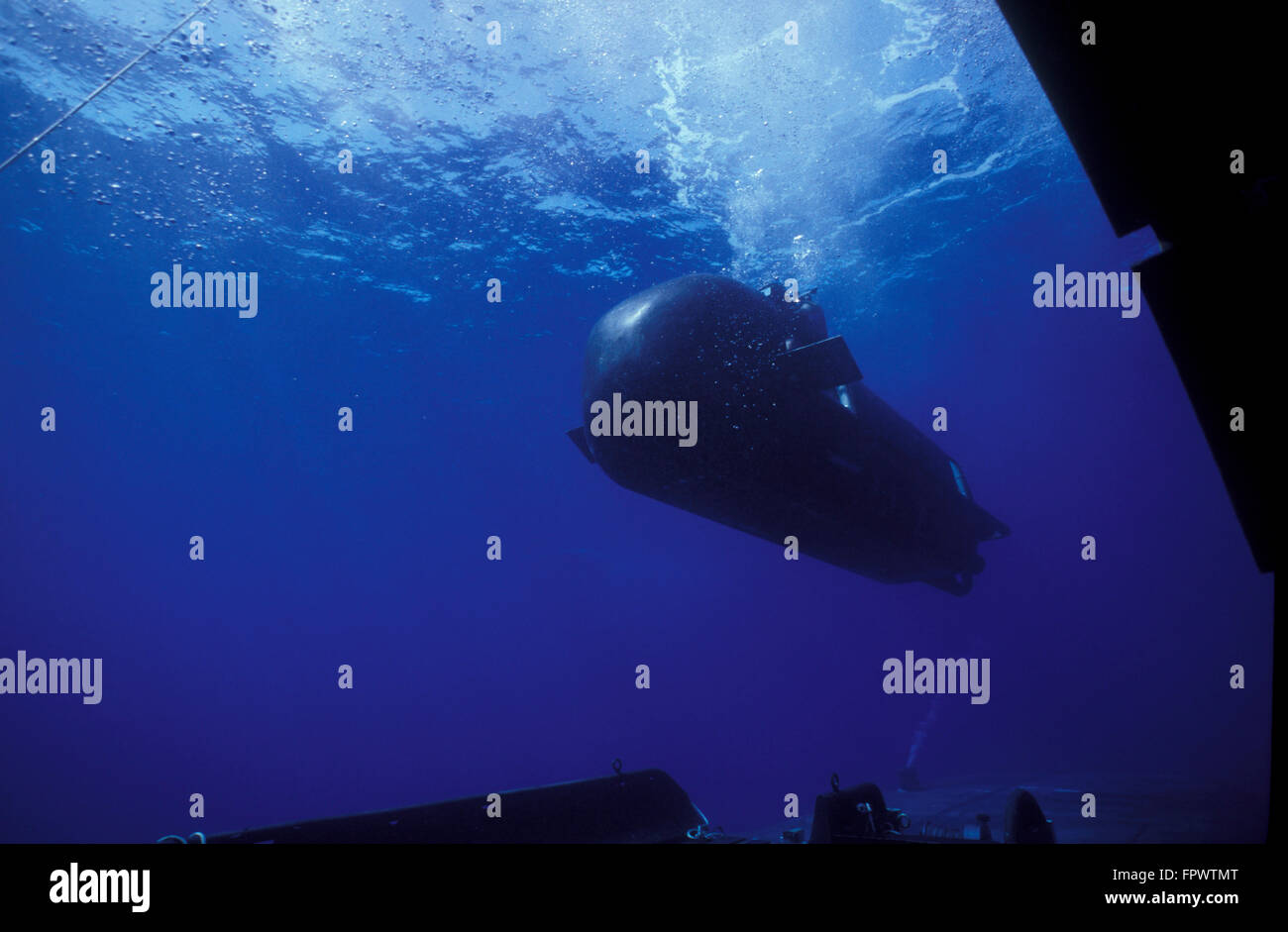 A SEAL Delivery Vehicle (SDV) flys by the open 9-foot diameter Dry Deck ...