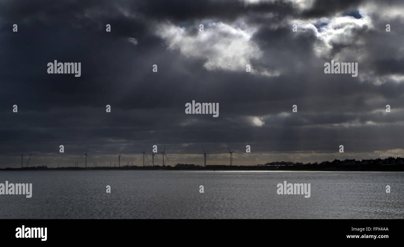 Wind turbine farm with angry sky on east coast of UK Stock Photo - Alamy