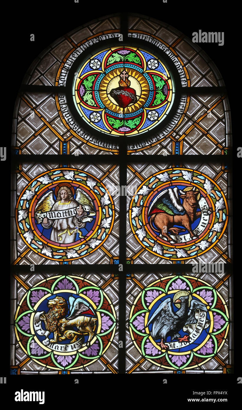 Symbols of the Evangelists, stained glass window in the parish church ...