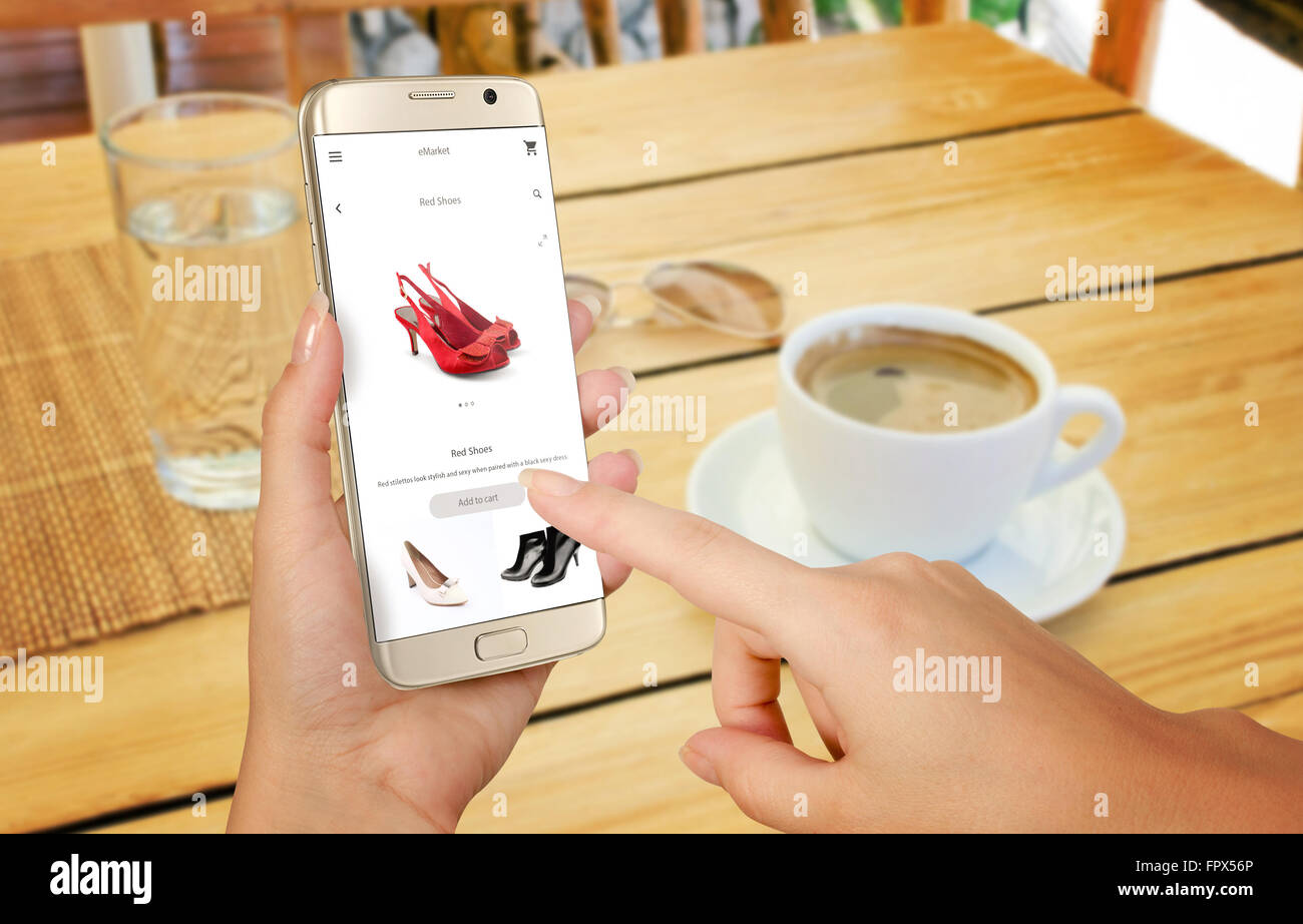 Online shopping with smart phone. Isolated phone in woman hand. Buying ...