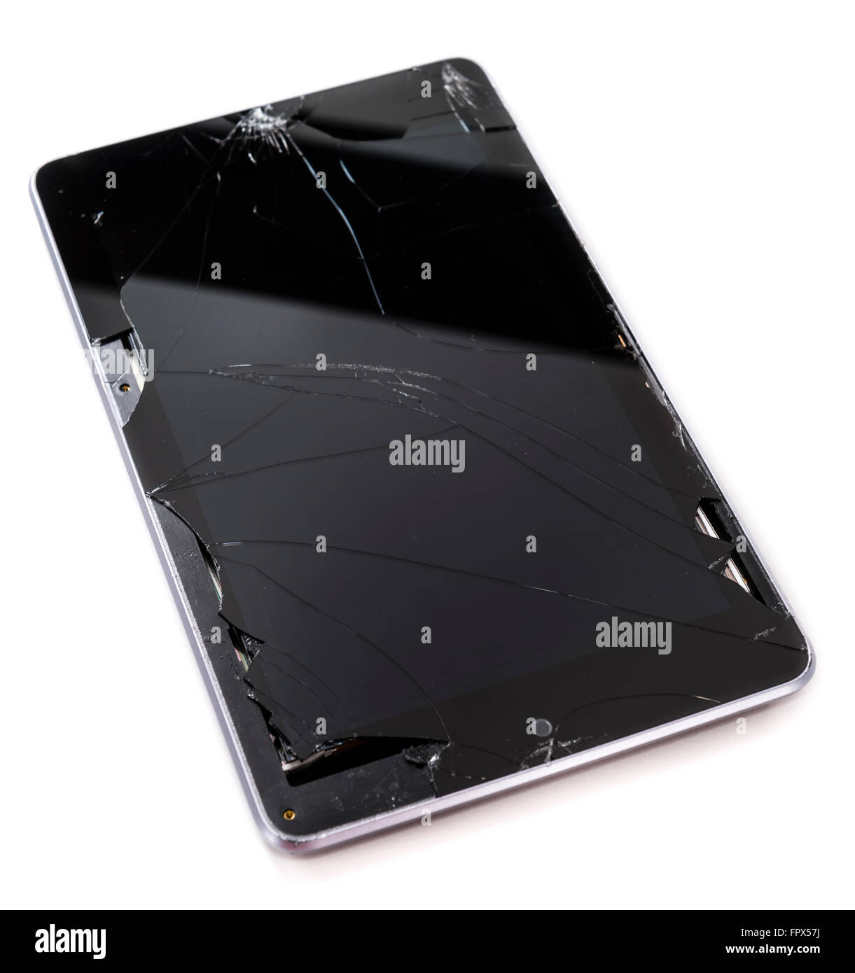 A broken tablet computer as detailed close-up shot on neutral white ...