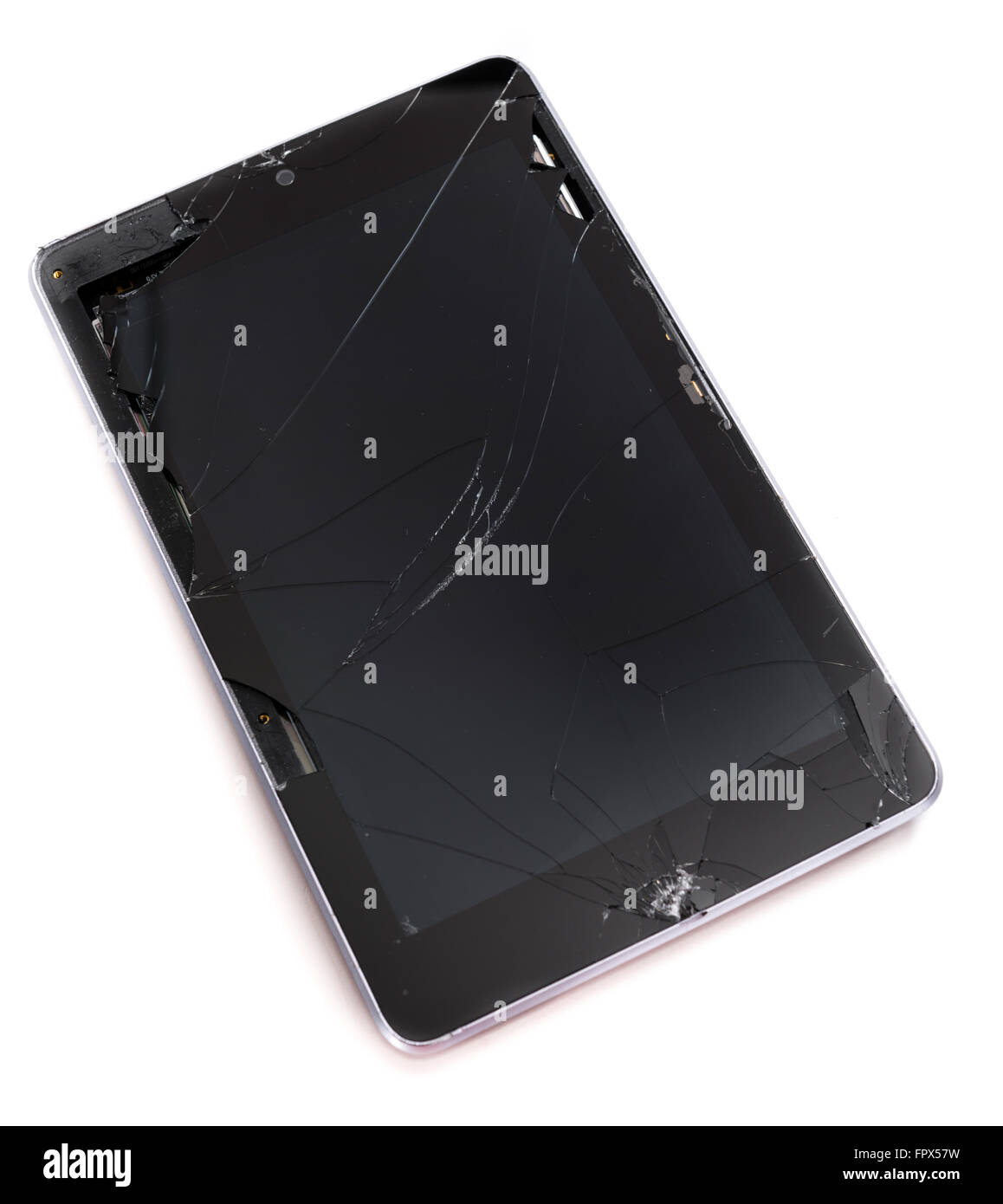 A broken tablet computer as detailed close-up shot on neutral white ...