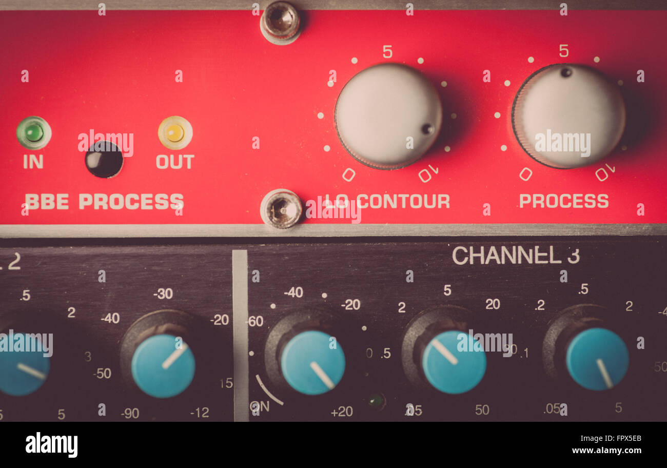 Color image of many buttons on a sound mixer in a recording studio ...