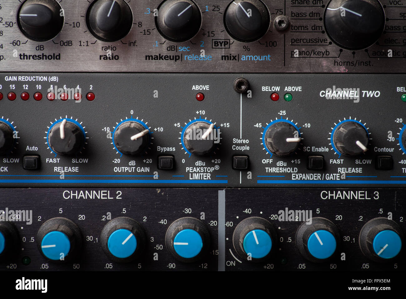 Color image of many buttons on a sound mixer in a recording studio ...