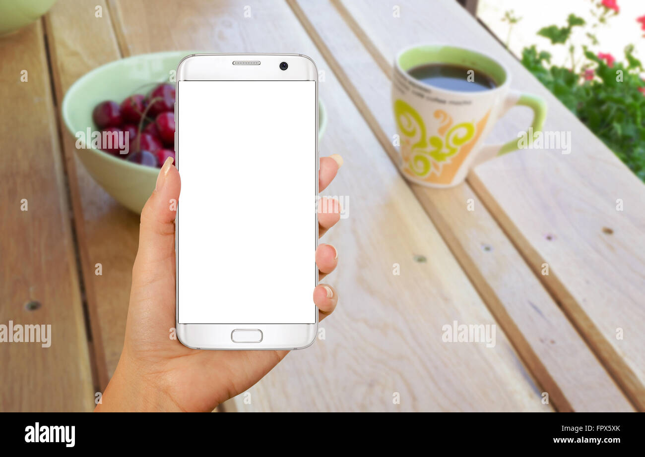 Smart phone with isolated display for mockup in hand. Relax time with ...