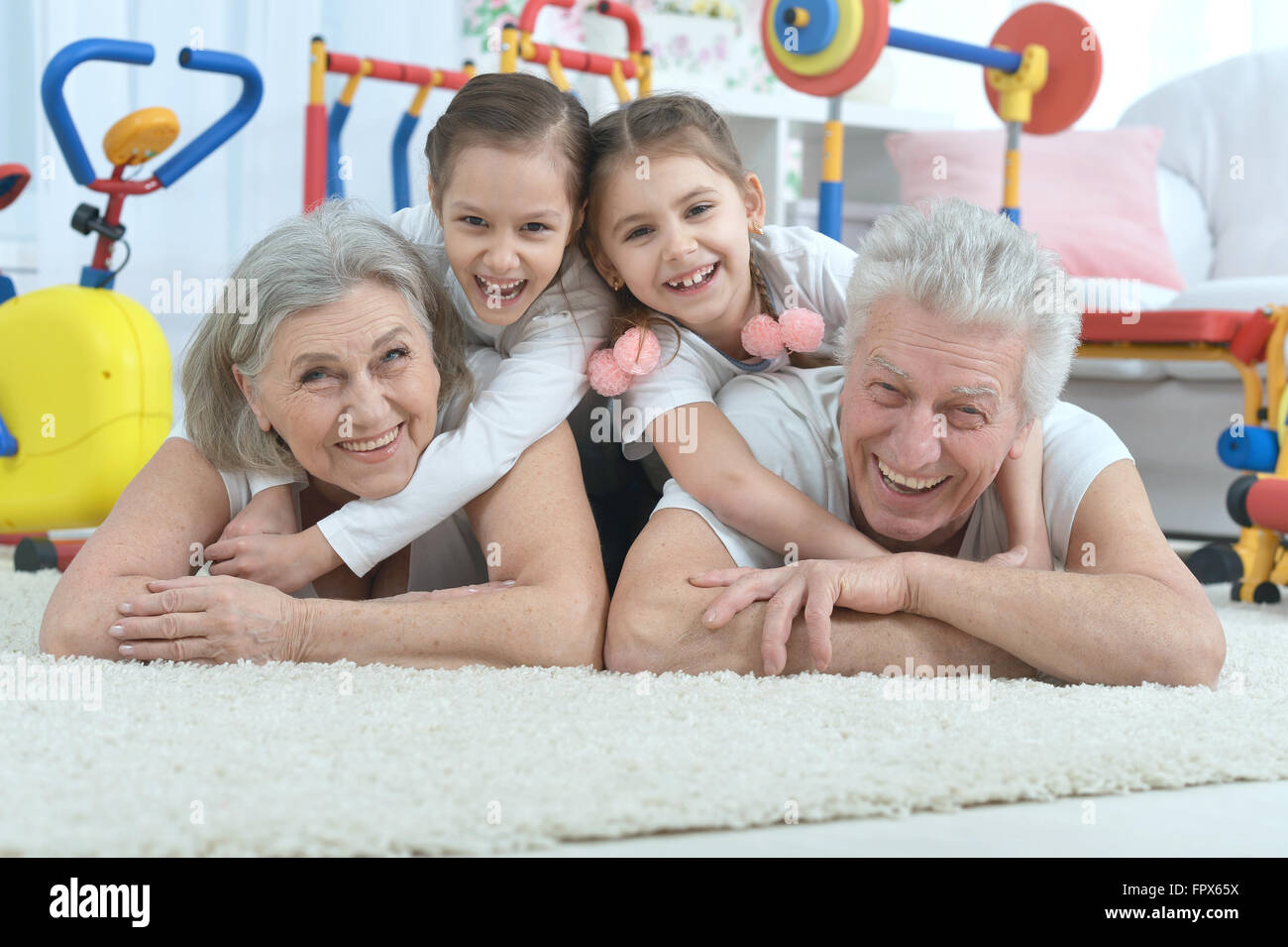 grandparents and granddaughters doing exercise Stock Photo - Alamy