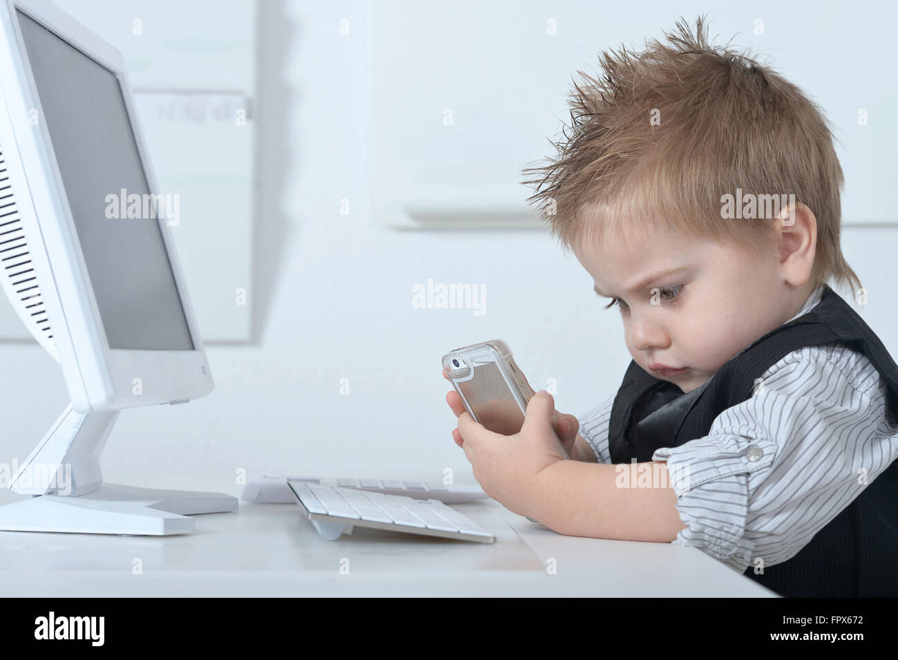 cute Little boy with computer Stock Photo - Alamy