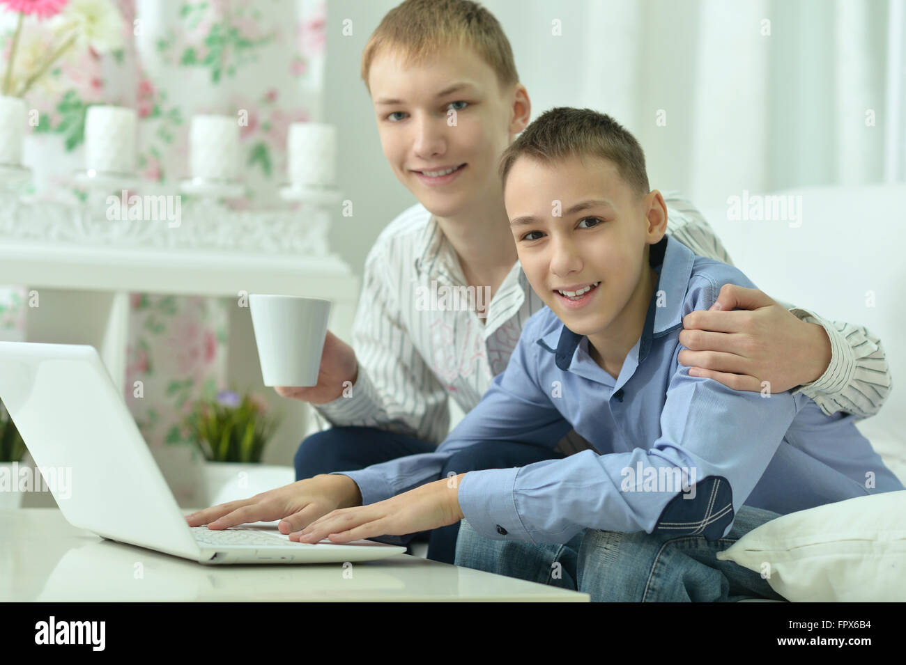 Young boys and laptop computer Stock Photo - Alamy