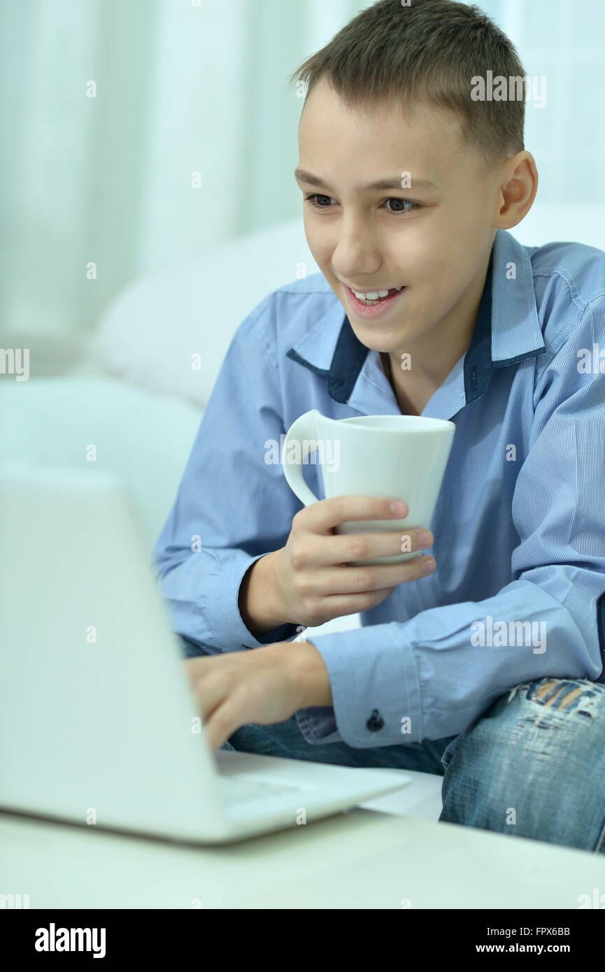 Young boy and laptop computer Stock Photo - Alamy