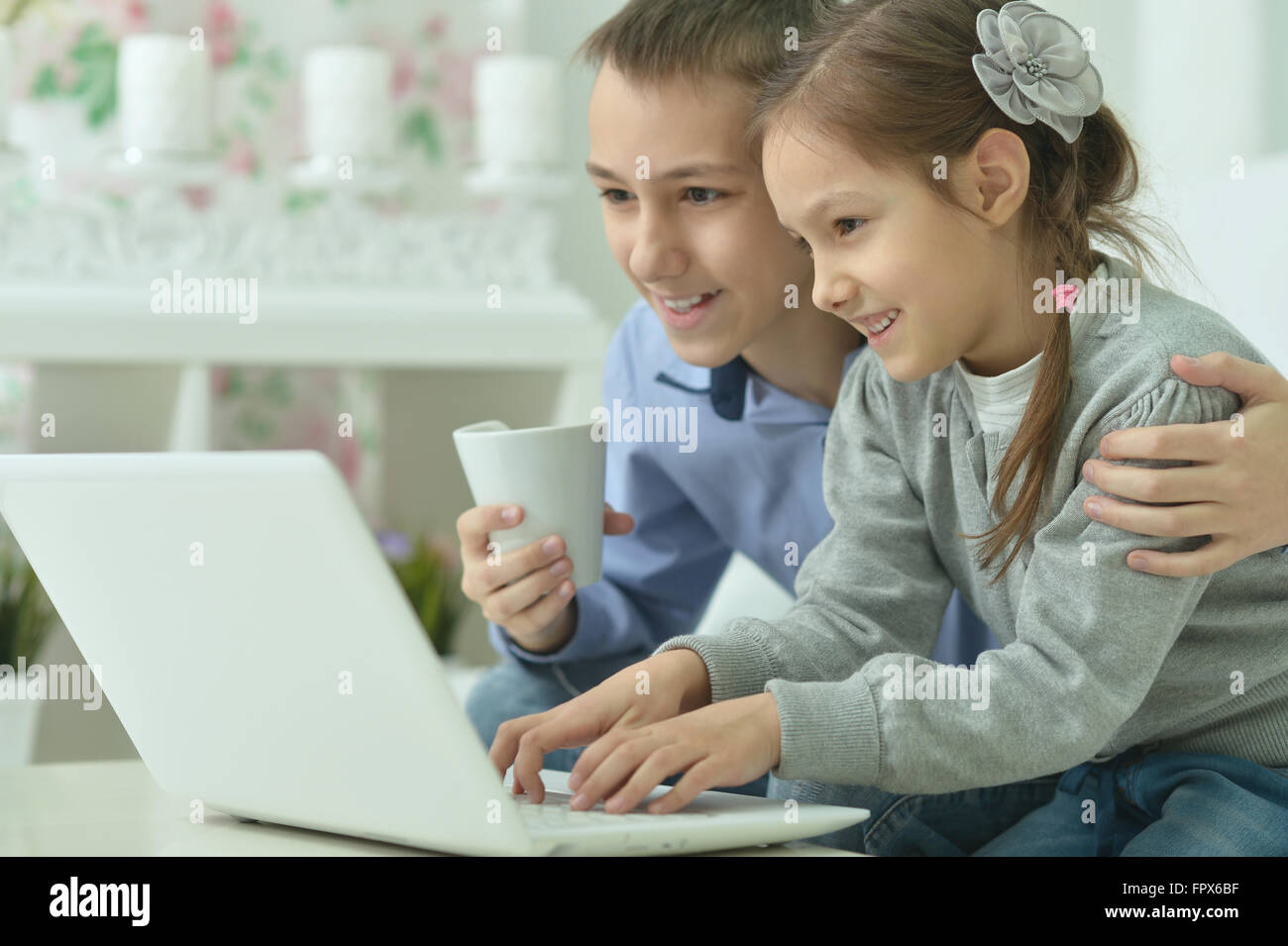 Children with laptop at home Stock Photo - Alamy