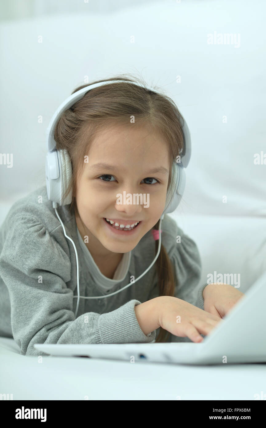 smiling little girl with laptop computer Stock Photo - Alamy
