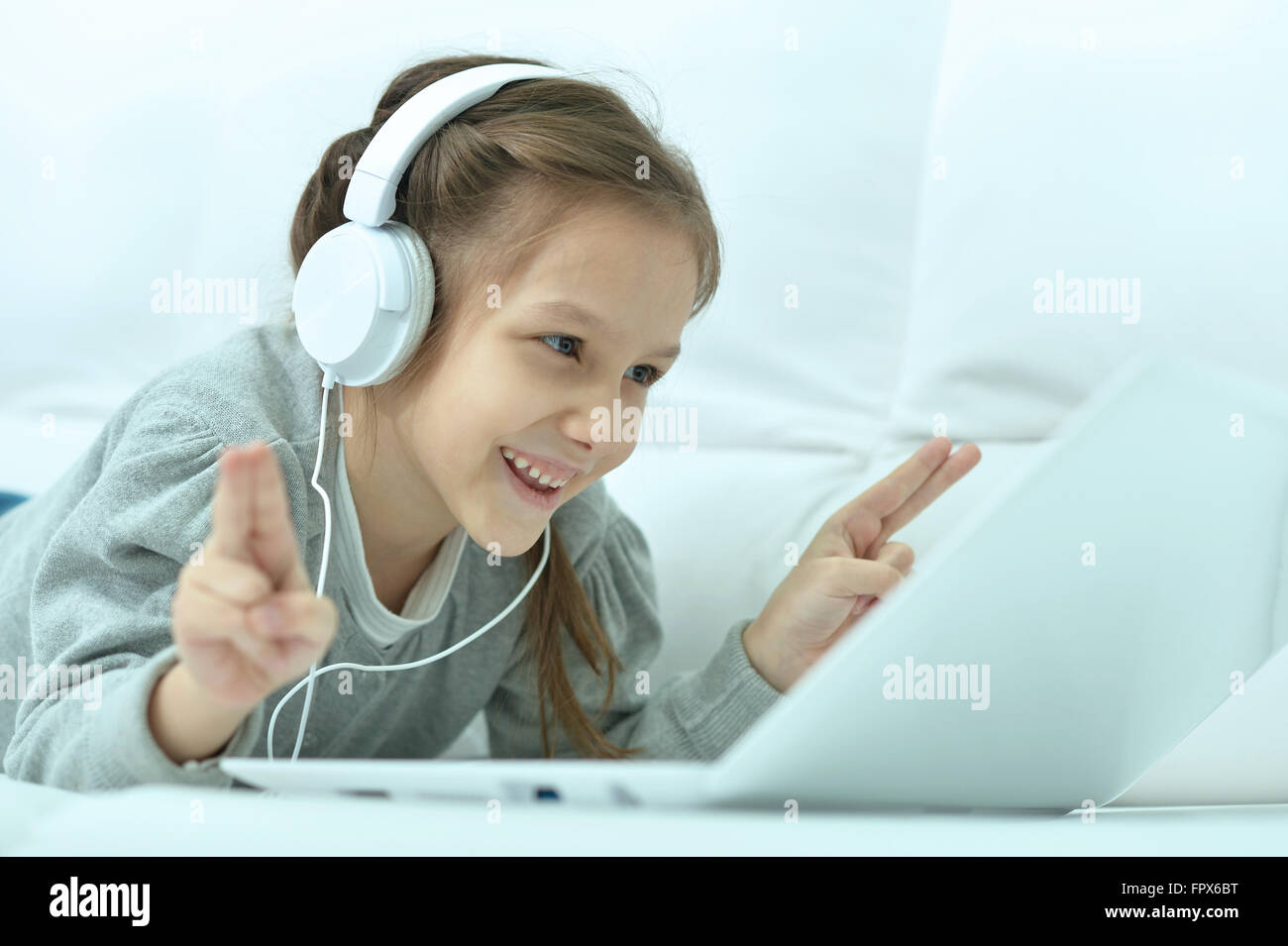 smiling little girl with laptop computer Stock Photo - Alamy