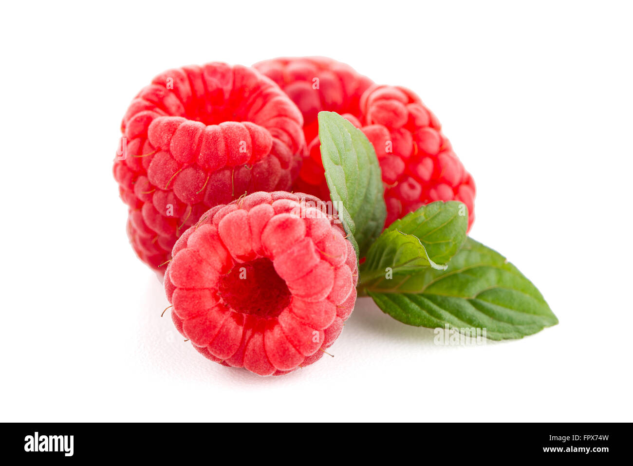 Raspberries with leaves isolated on white background Stock Photo - Alamy
