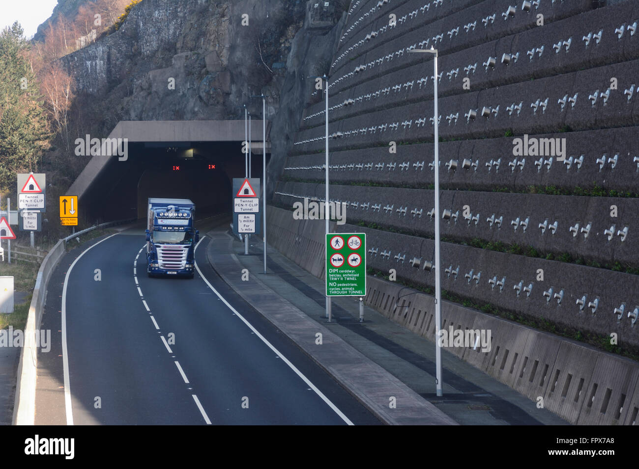 Vehicles emerging from the Pen y Clip tunnel between Penmaenmawr and ...
