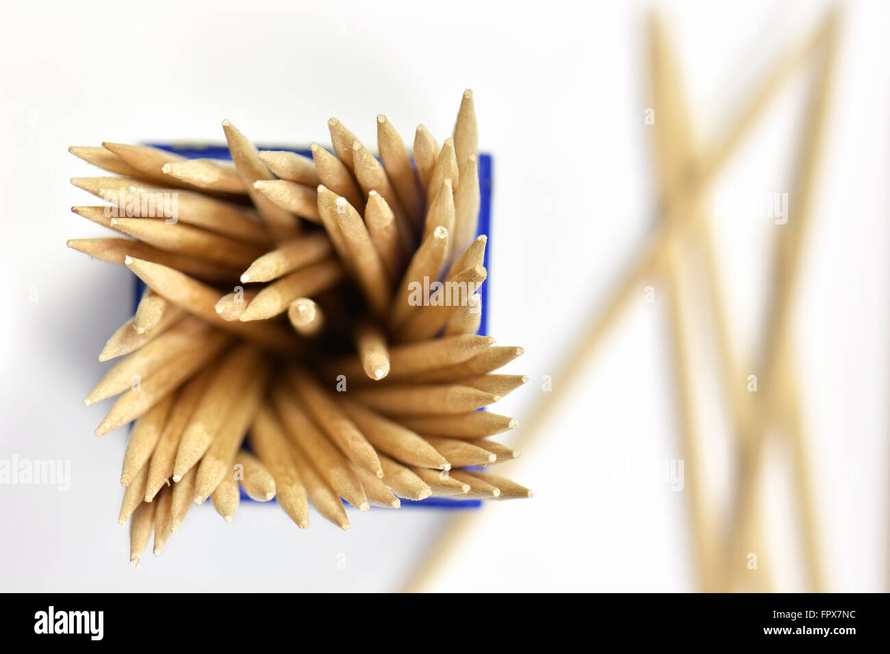 Aerial view of cocktail sticks in container on white background Stock ...