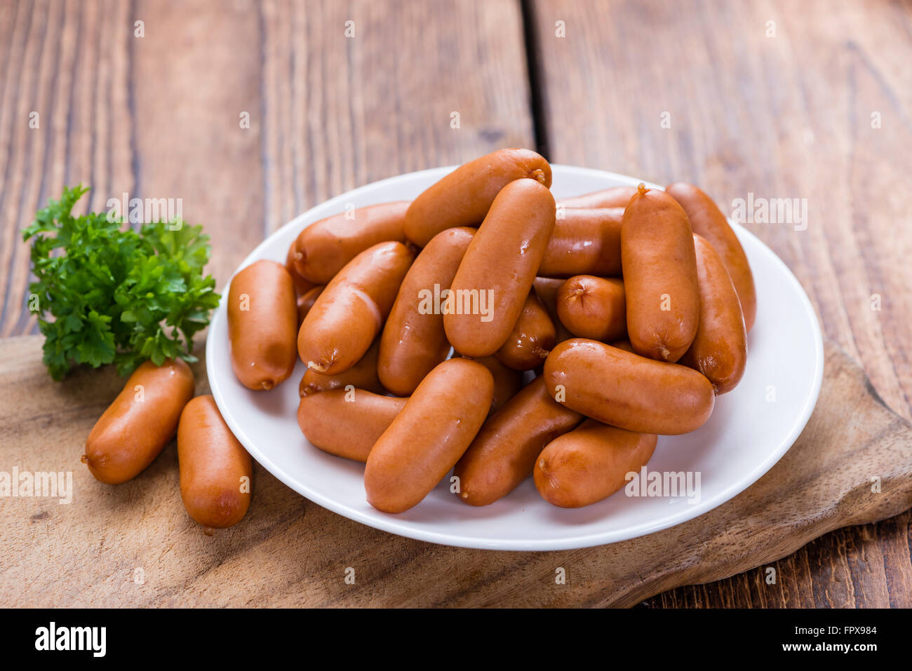 Party Food (Mini Sausages) on an old rustic wooden table Stock Photo ...