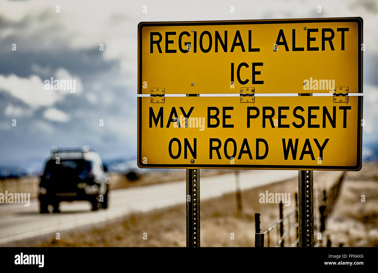 Highway road sign ice alert winter storm car truck danger Stock Photo ...