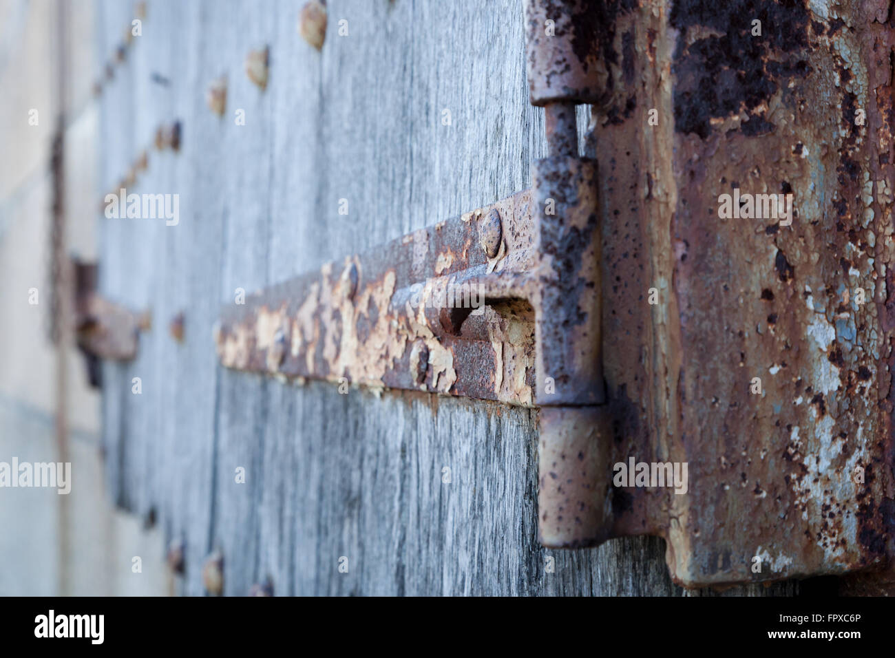 Details of an old rusty hinge on wooden shutters Stock Photo - Alamy