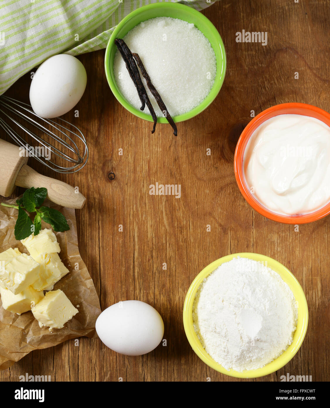 Ingredients for pastry - butter, milk, eggs, flour and vanilla sugar on ...