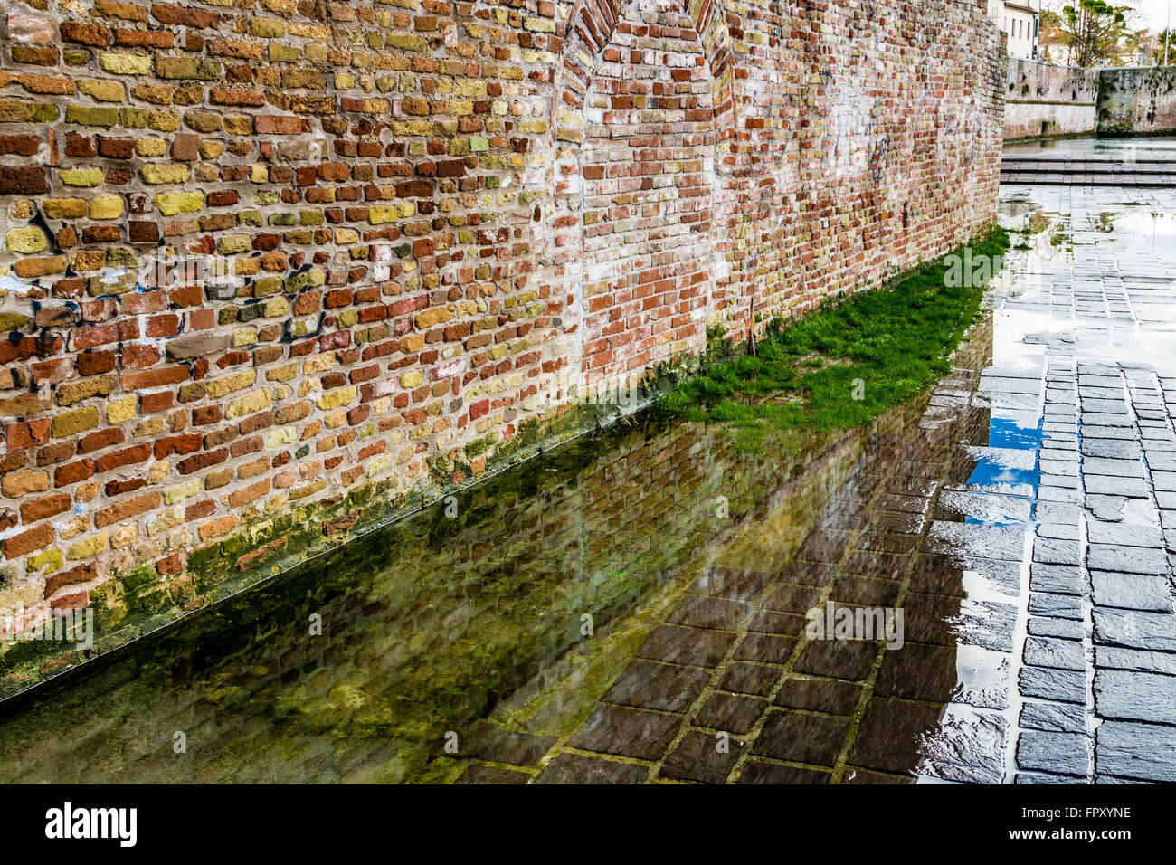 old brick wall reflected in a puddle Stock Photo - Alamy