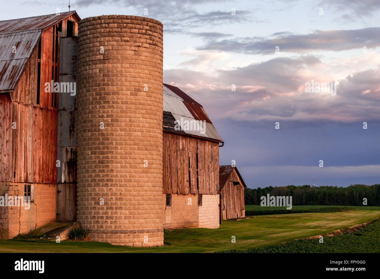 Colour landscape image showing traditional wood barn on a farm in ...