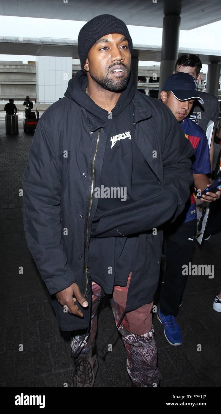Kanye West departs on a flight from Los Angeles International Airport ...