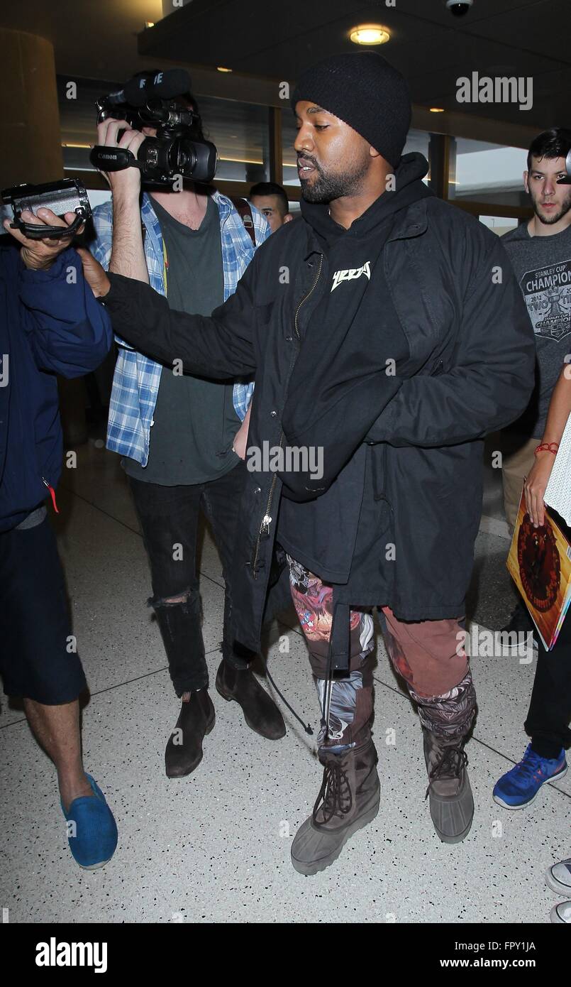 Kanye West departs on a flight from Los Angeles International Airport ...