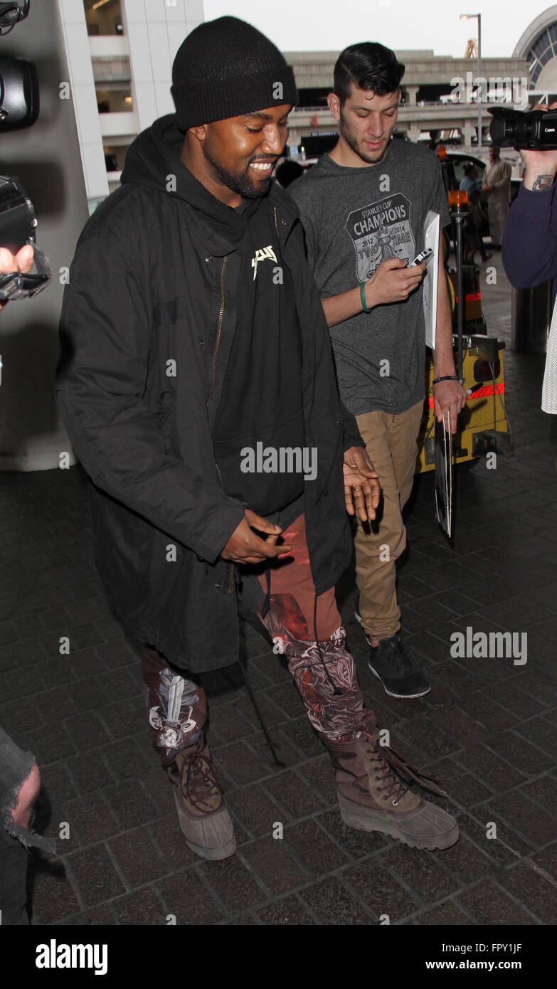 Kanye West departs on a flight from Los Angeles International Airport ...