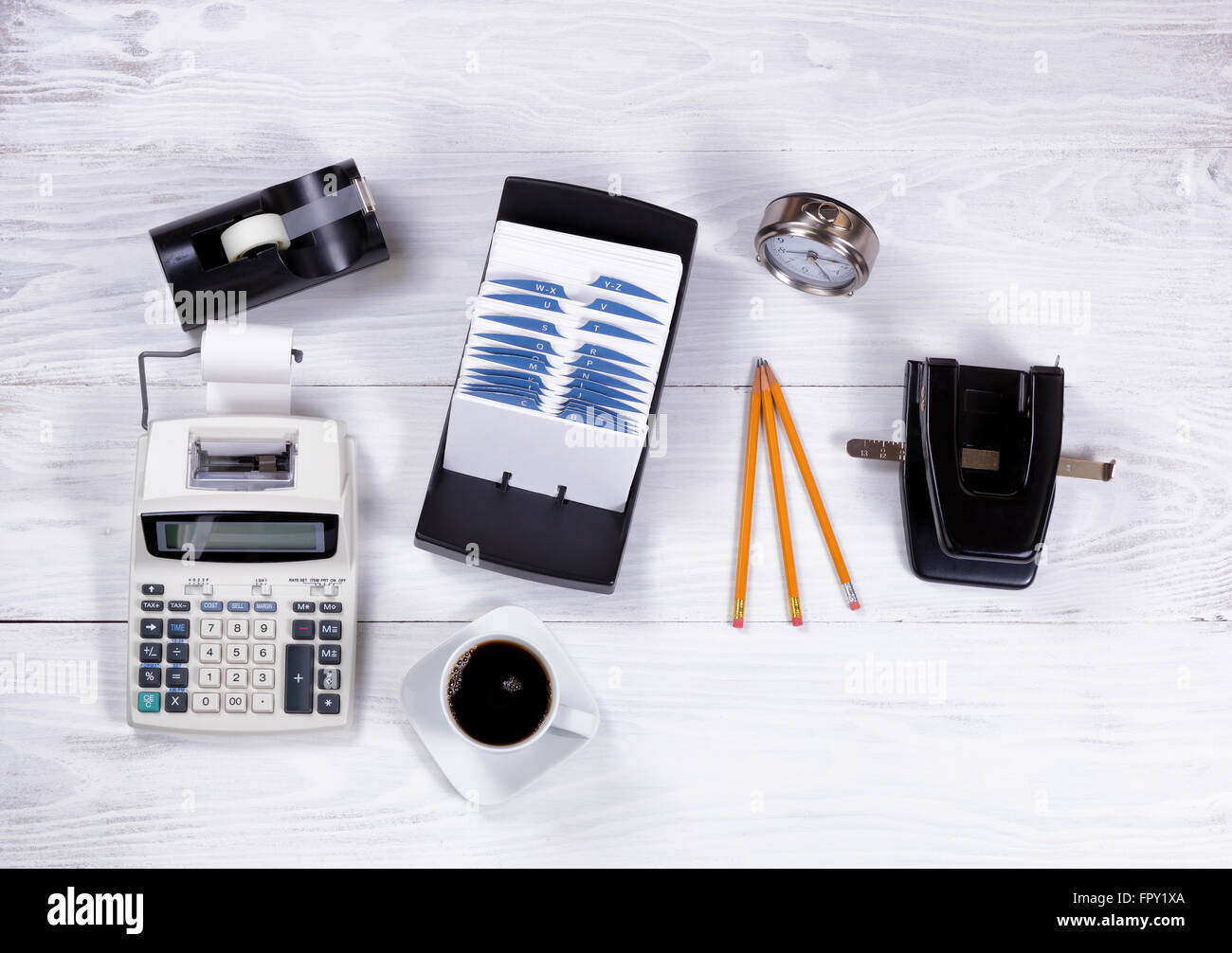 Overhead view of vintage white desktop with outdated office stationery ...