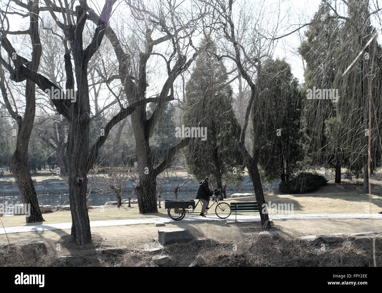 Chinese man riding a bike with cart. Working man in China. New Stock ...