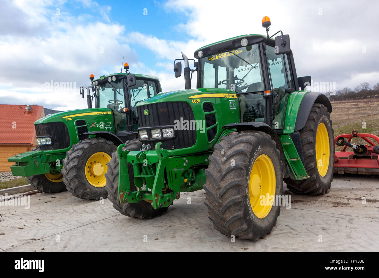 Two John Deere tractors parked Stock Photo - Alamy