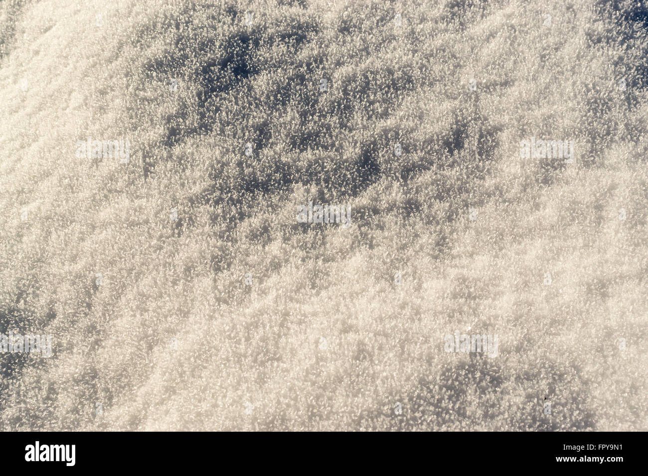 Natural snow background using daylight to reveal snowflakes and frost ...