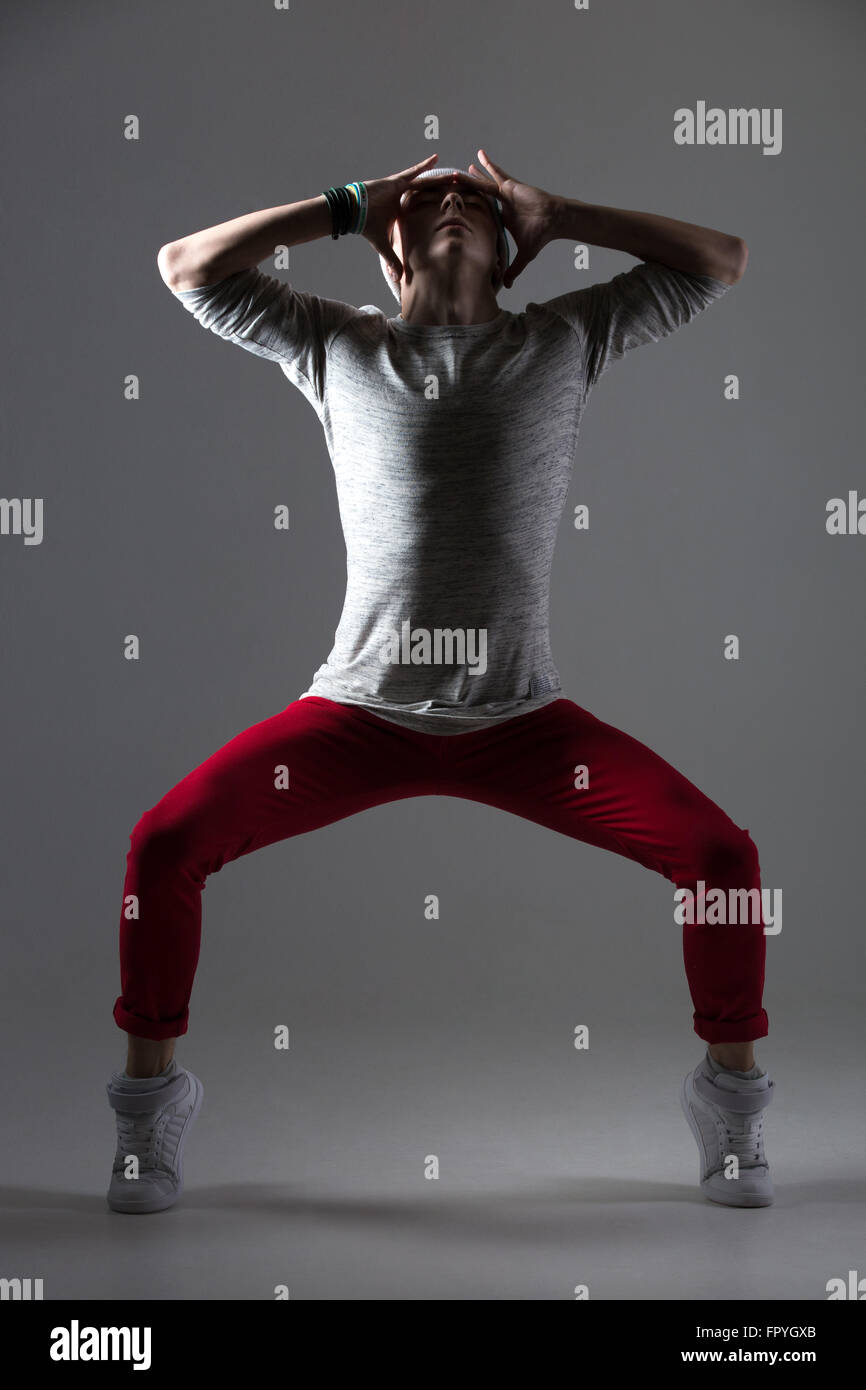 Portrait of one attractive fit young man dancing, working out wearing ...