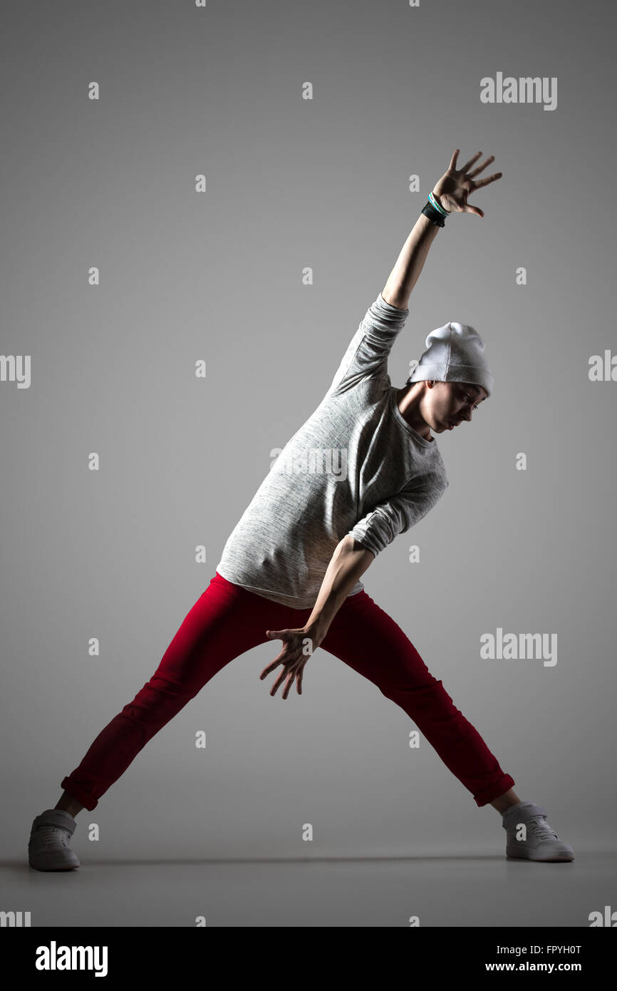 Portrait of one handsome fit young man dancing, working out wearing ...