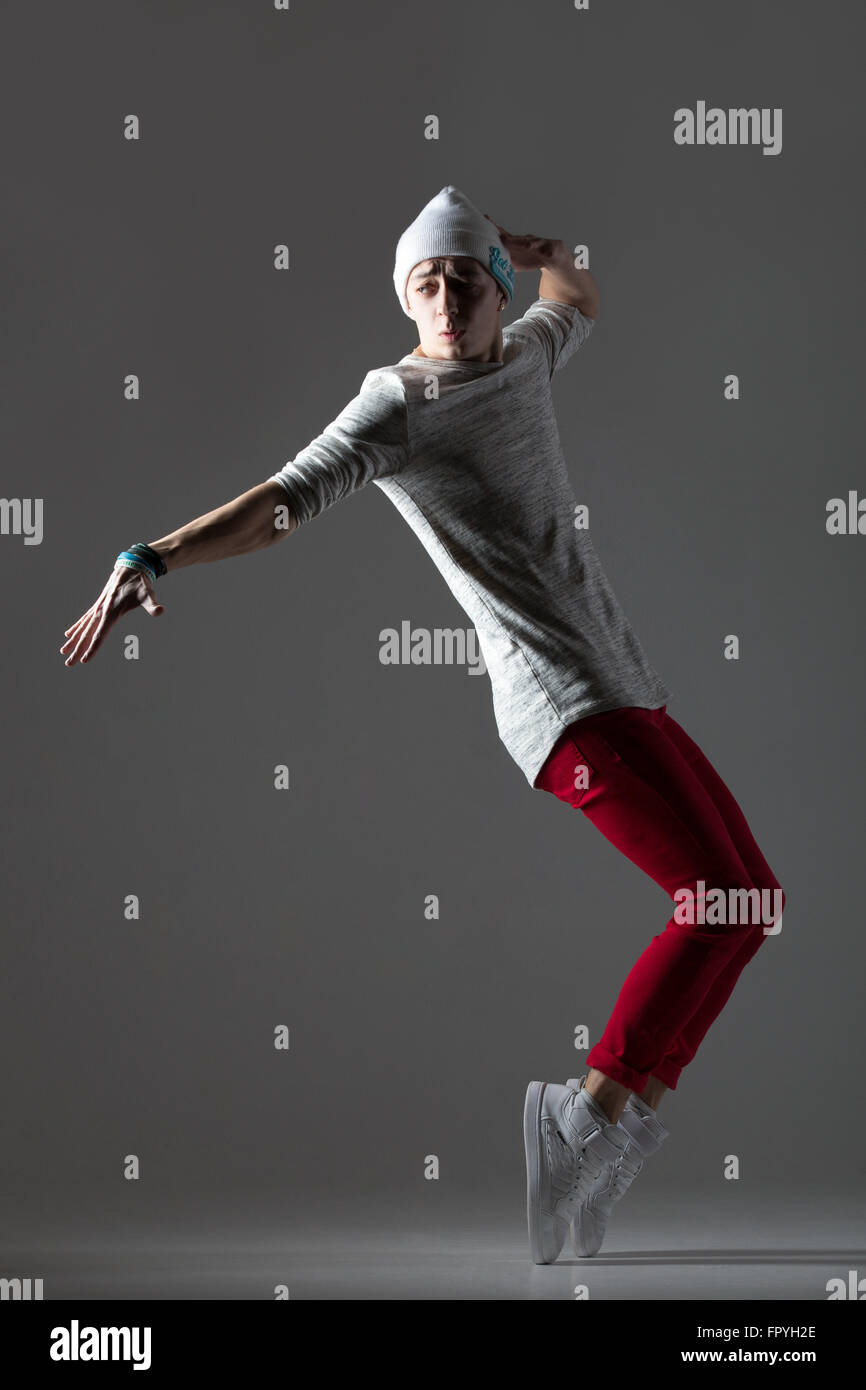 Portrait of one attractive fit young man dancing, working out wearing ...