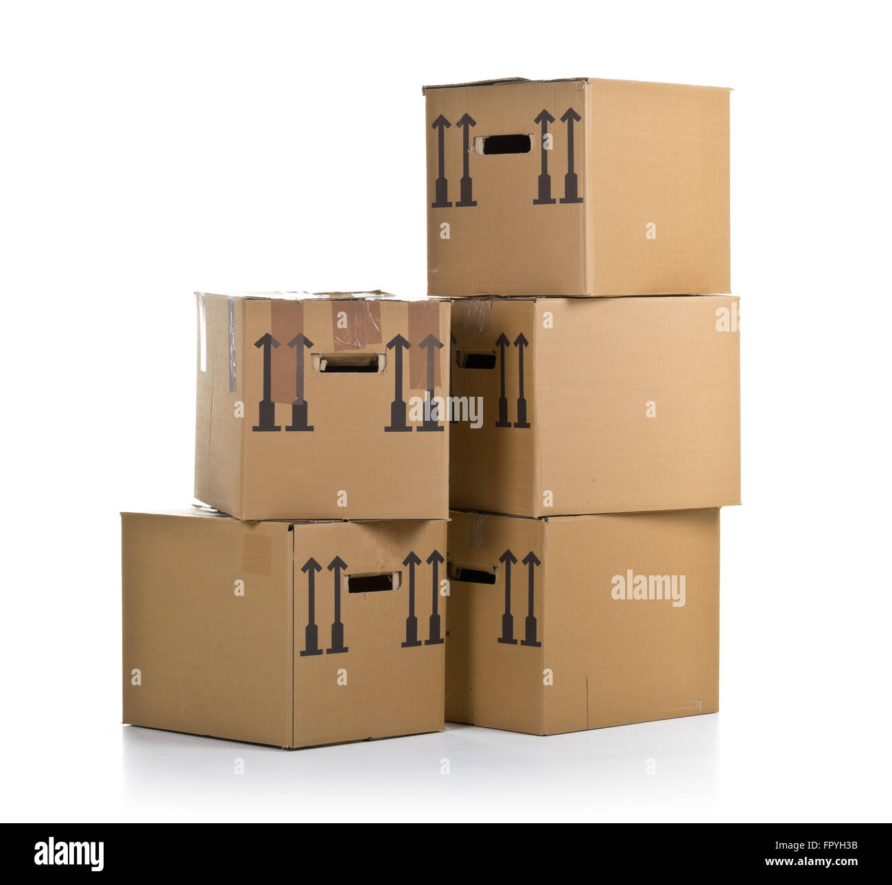Stacked moving carton boxes over white background Stock Photo - Alamy