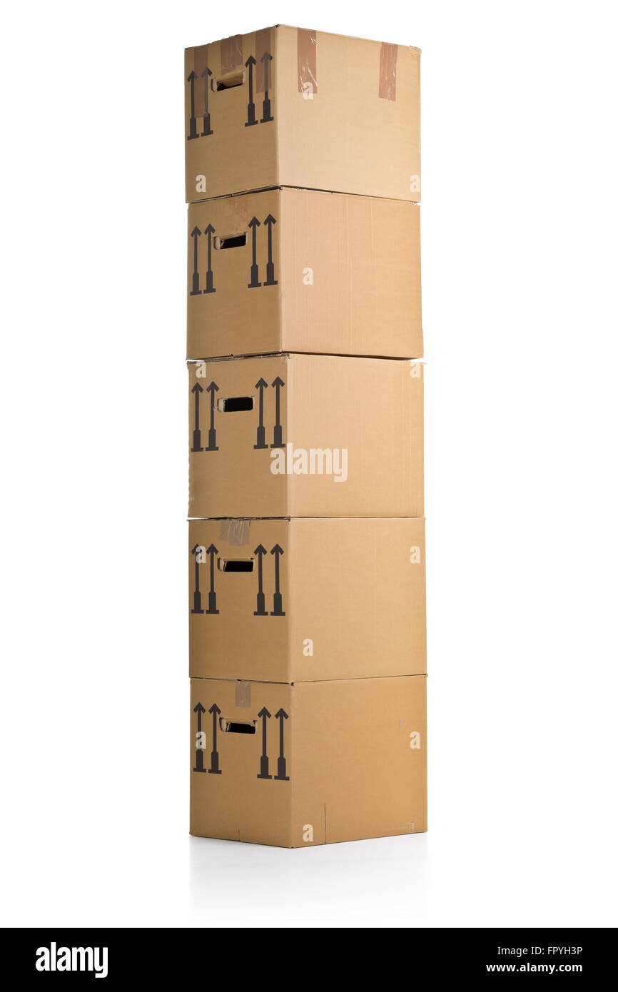 Stacked moving carton boxes over white background Stock Photo - Alamy