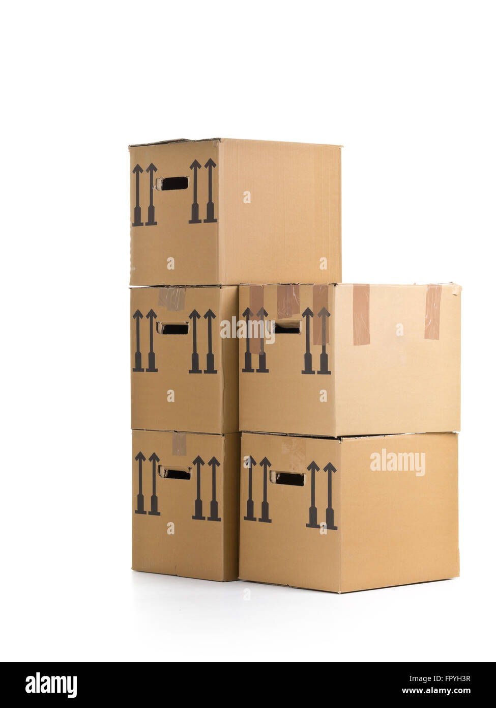 Stacked moving carton boxes over white background Stock Photo - Alamy