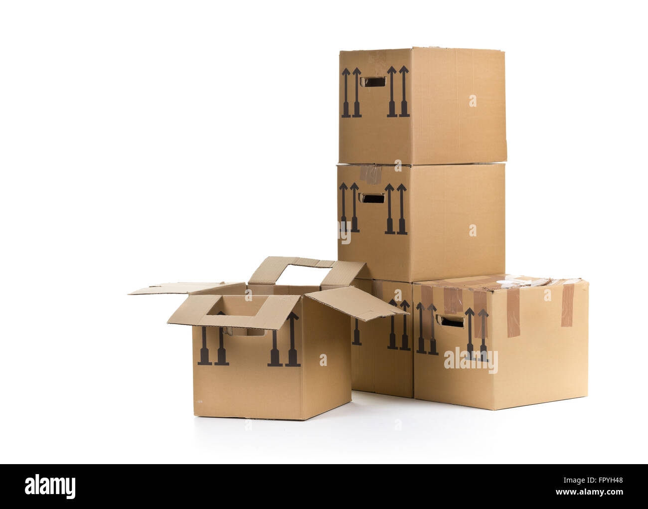 Stacked moving carton boxes over white background Stock Photo - Alamy