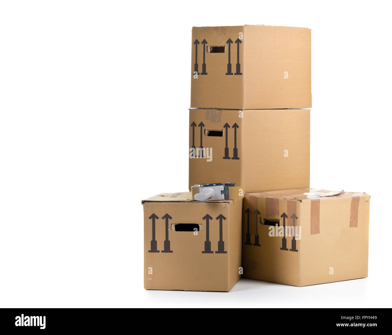 Tape roller on stack of moving carton boxes over white background Stock ...