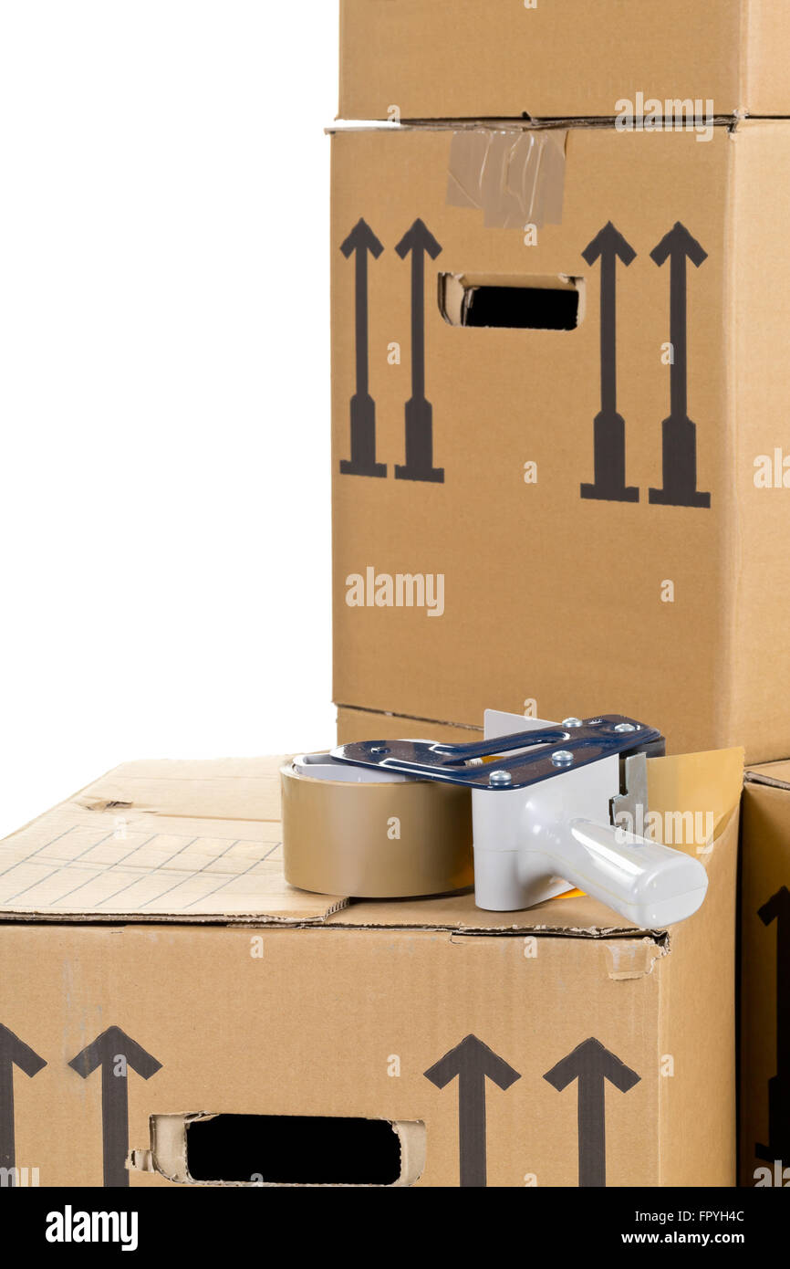 Tape roller on stack of moving carton boxes over white background Stock ...