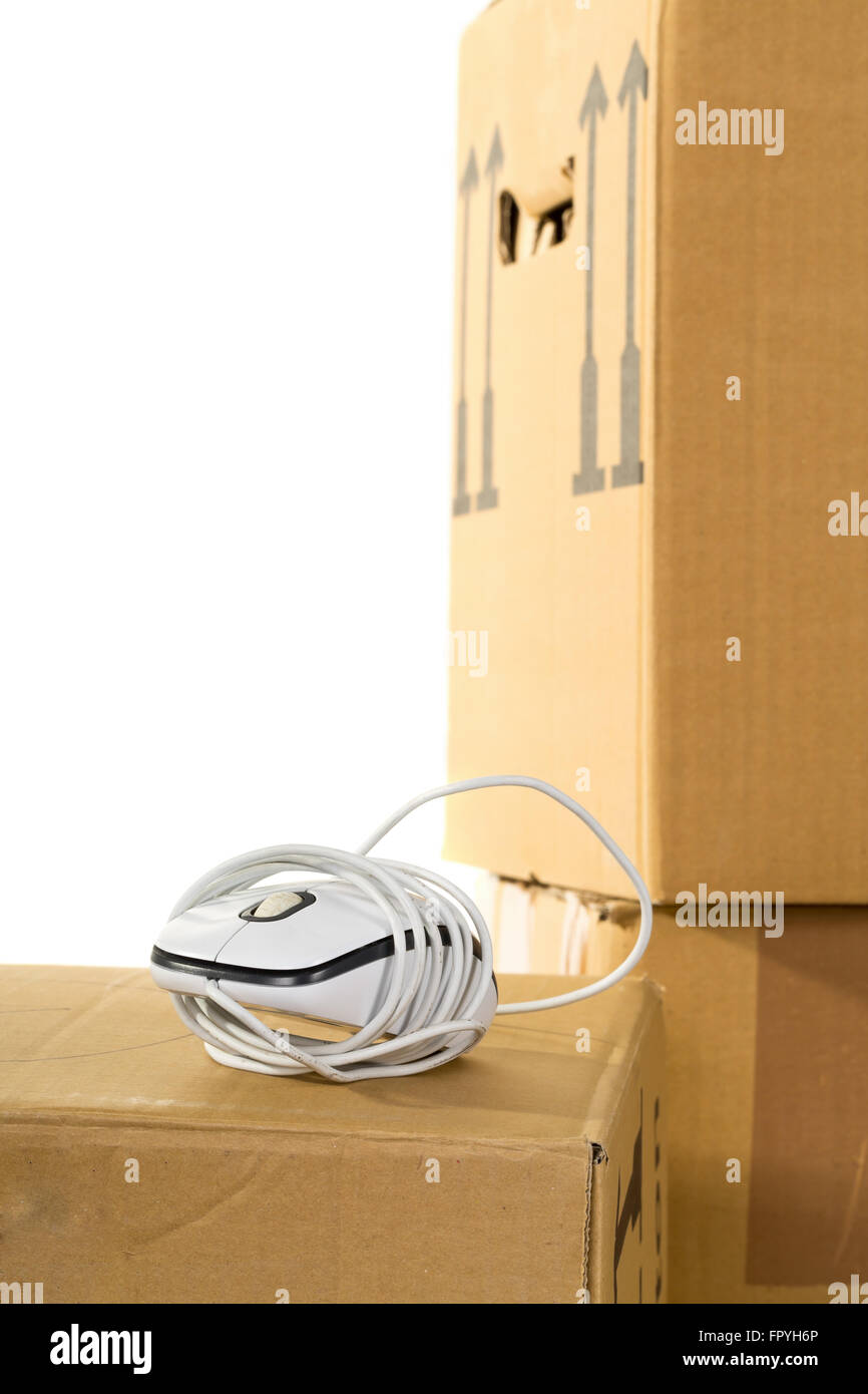 Computer mouse on moving boxes over white background - office moving or ...