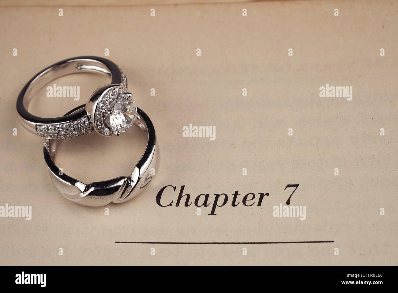 wedding rings on book Stock Photo - Alamy