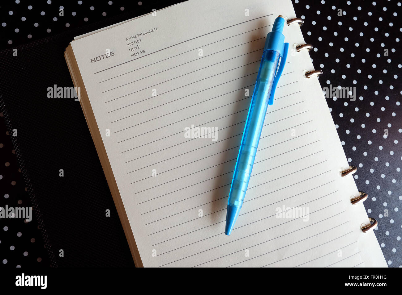Note book paper with pen Stock Photo - Alamy