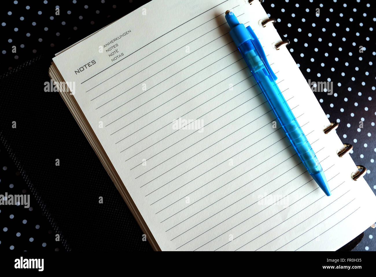 Note book paper with pen Stock Photo - Alamy