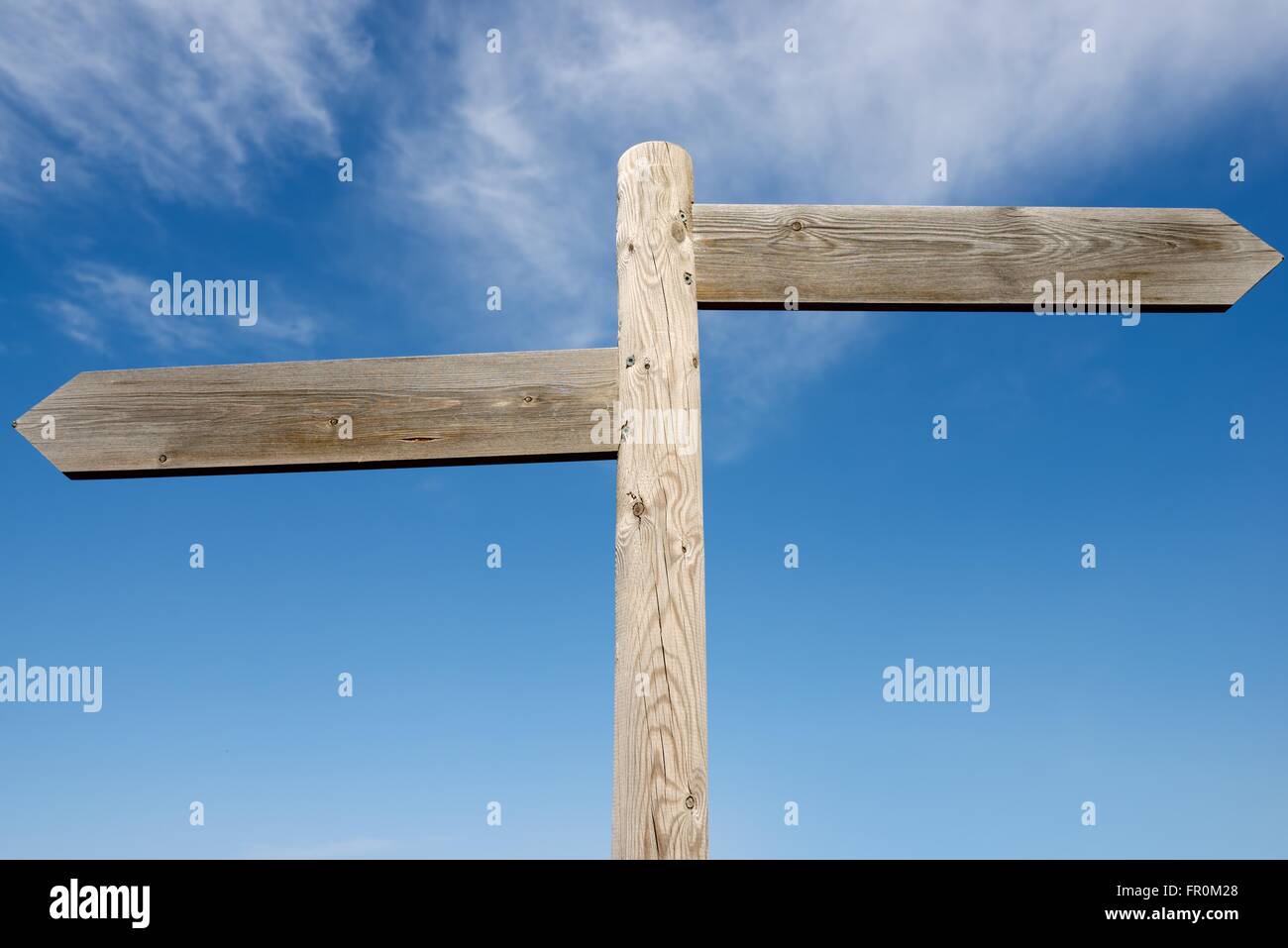 View of two directional wood signals Stock Photo - Alamy