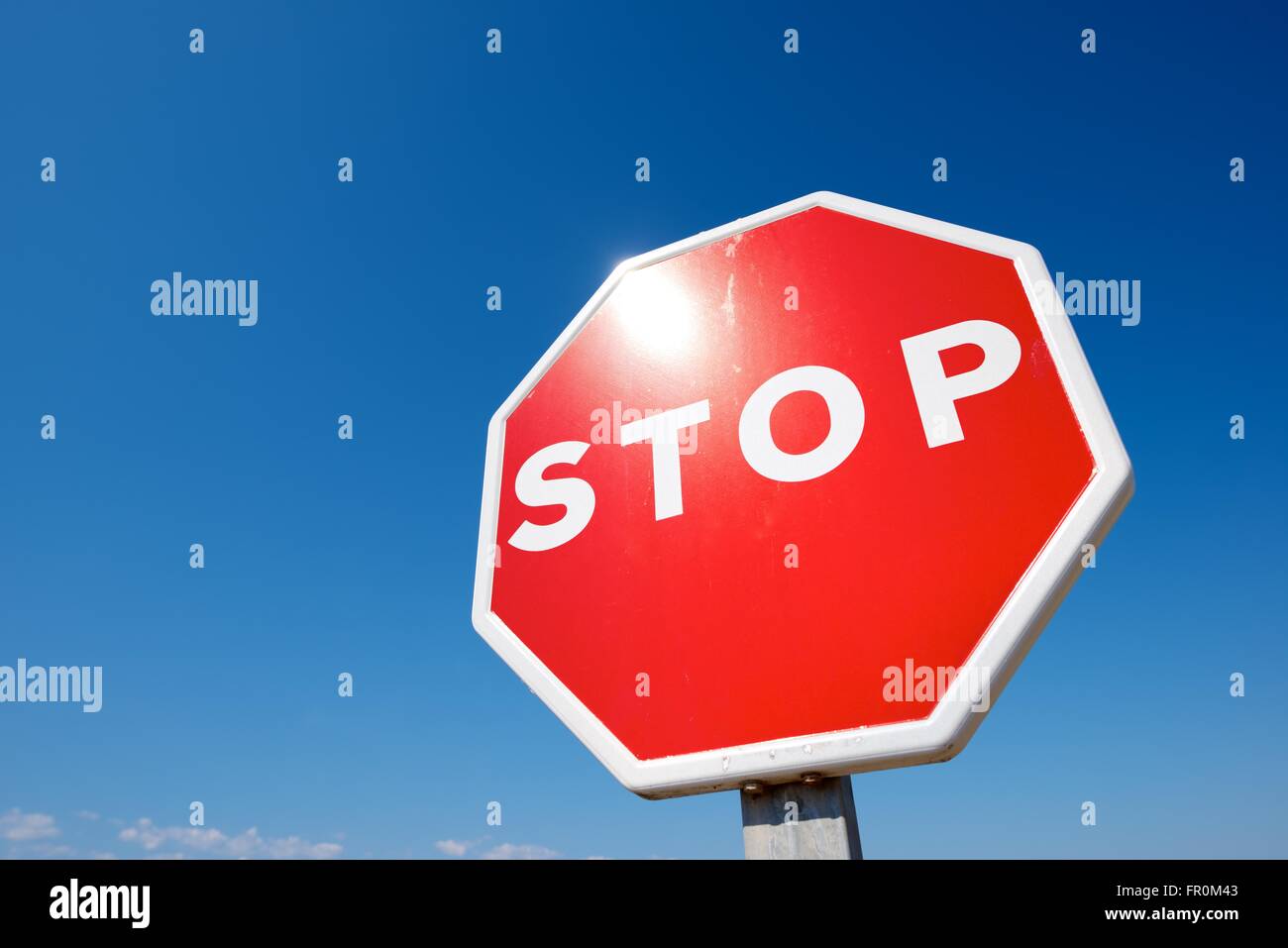 Stop traffic sign with clear blue sky Stock Photo - Alamy