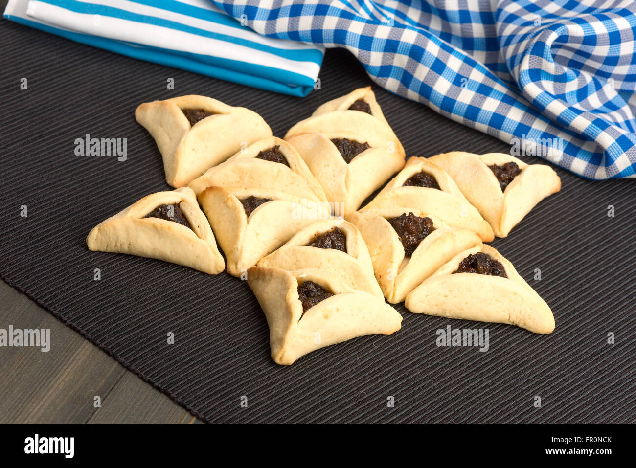 On Purim, Ashkenazi Jews eat triangular pastries called Hamantaschen ...